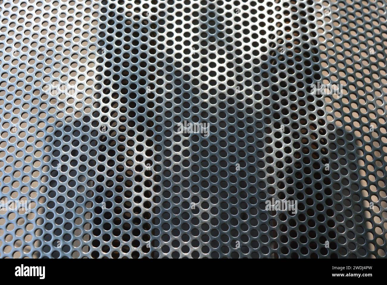 Metal mesh, background, with round identical holes, metal structure ...
