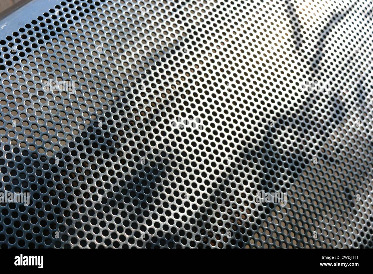 Metal mesh, background, with round identical holes, metal structure ...