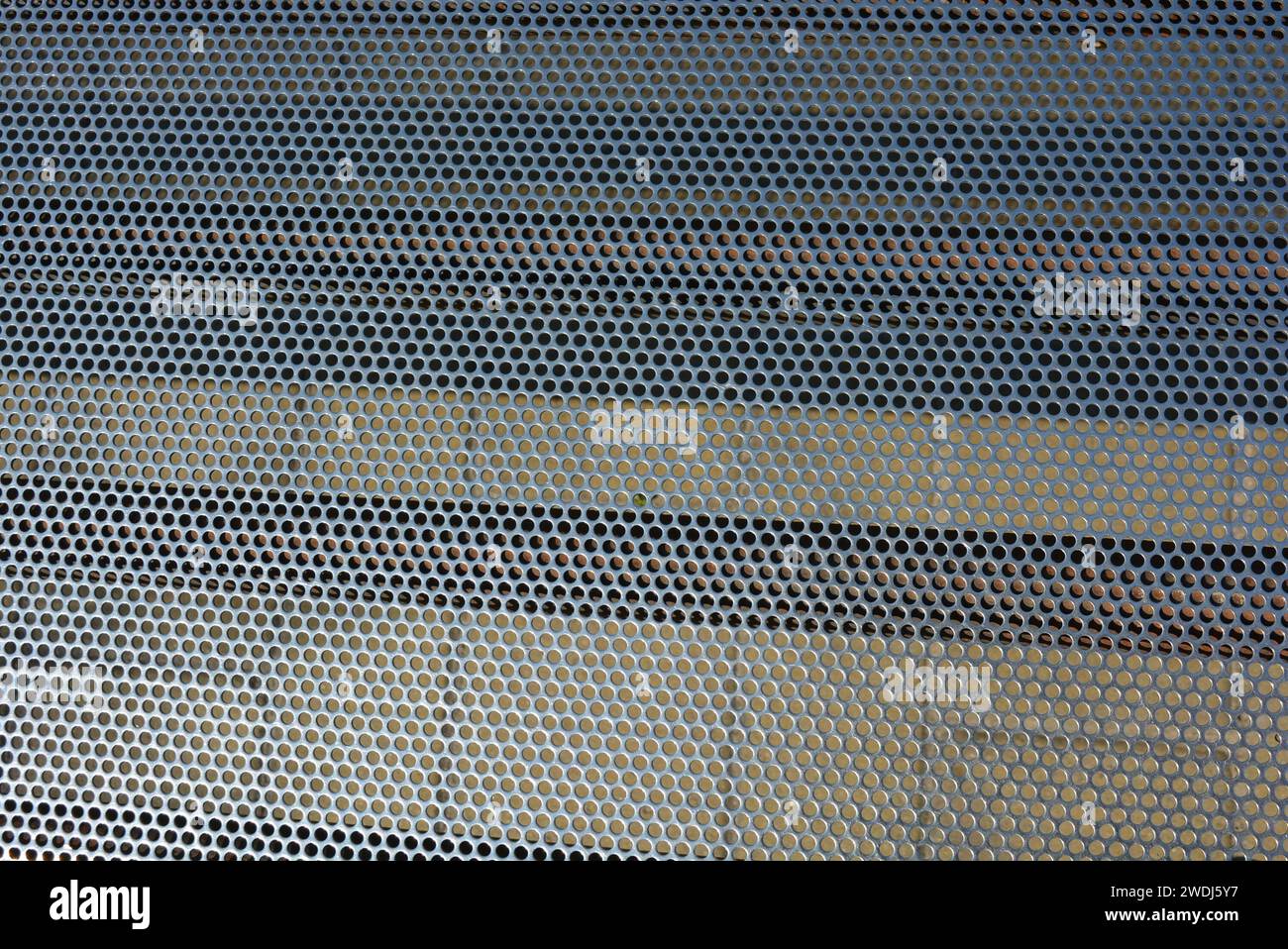 Metal mesh, background, with round identical holes, metal structure ...