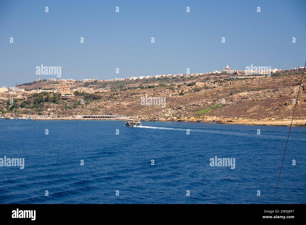 Mgarr, Malta - 19 June, 2023: Mgarr and its port and the town of La ...