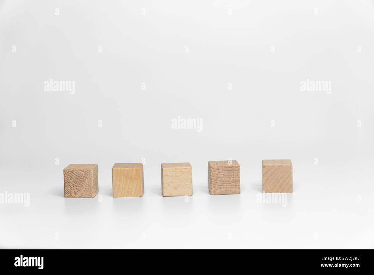 building wood blocks on white background; business or creative concept ...