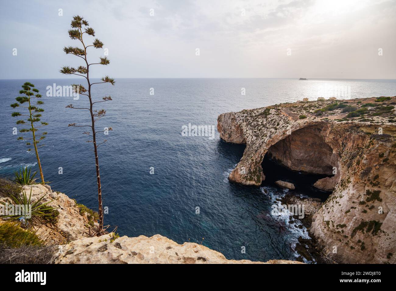 View of the natural stone arch and sea caves at Blue Grotto, Malta ...