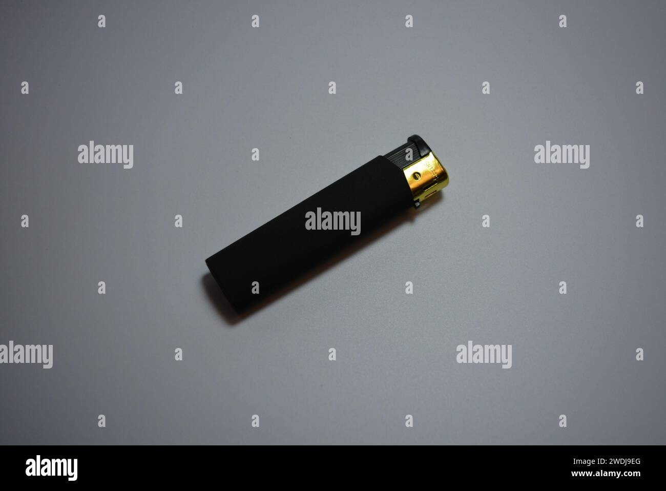 Lighter black matte on white paper background Stock Photo - Alamy