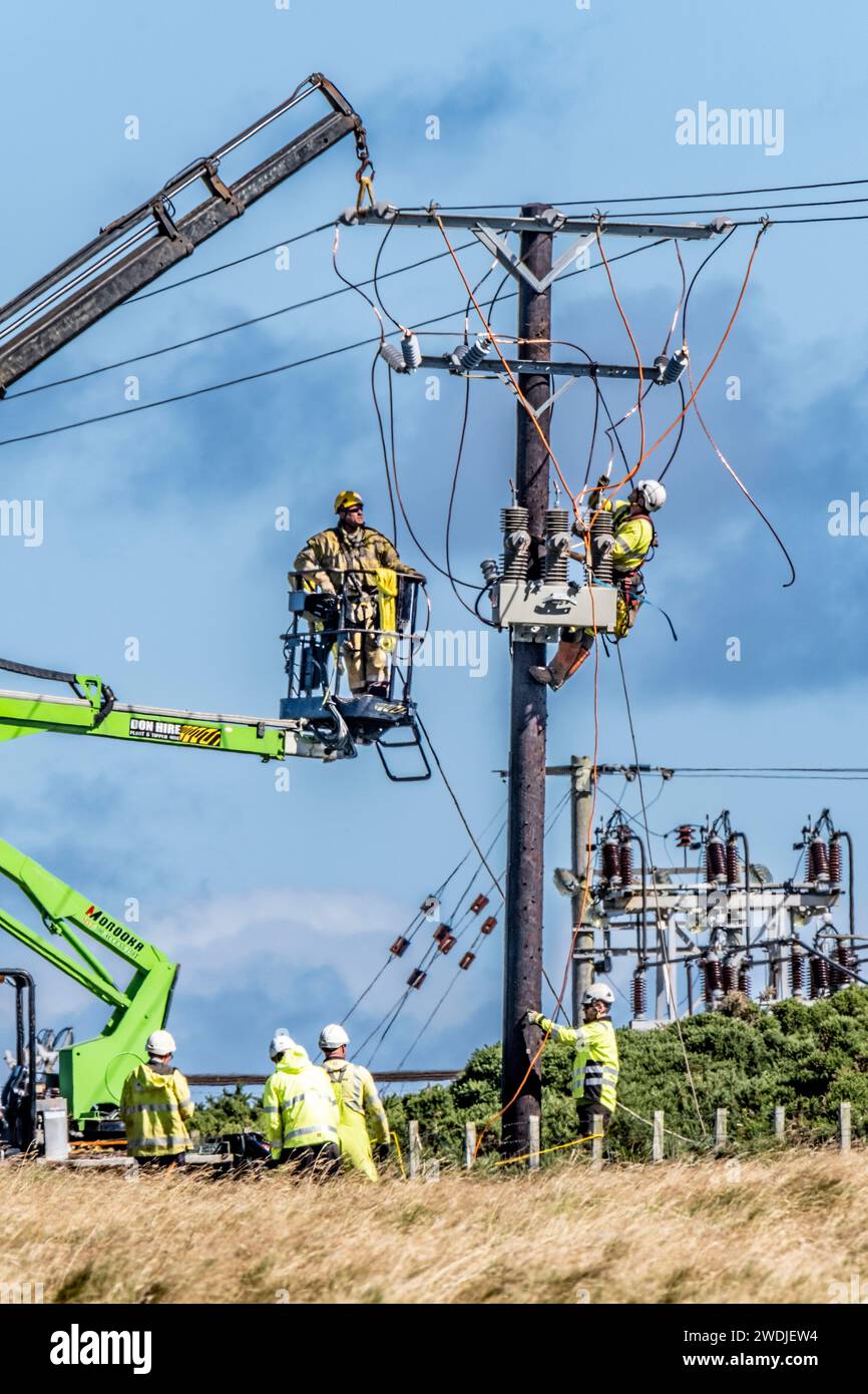 Electricity power line installation Stock Photo - Alamy