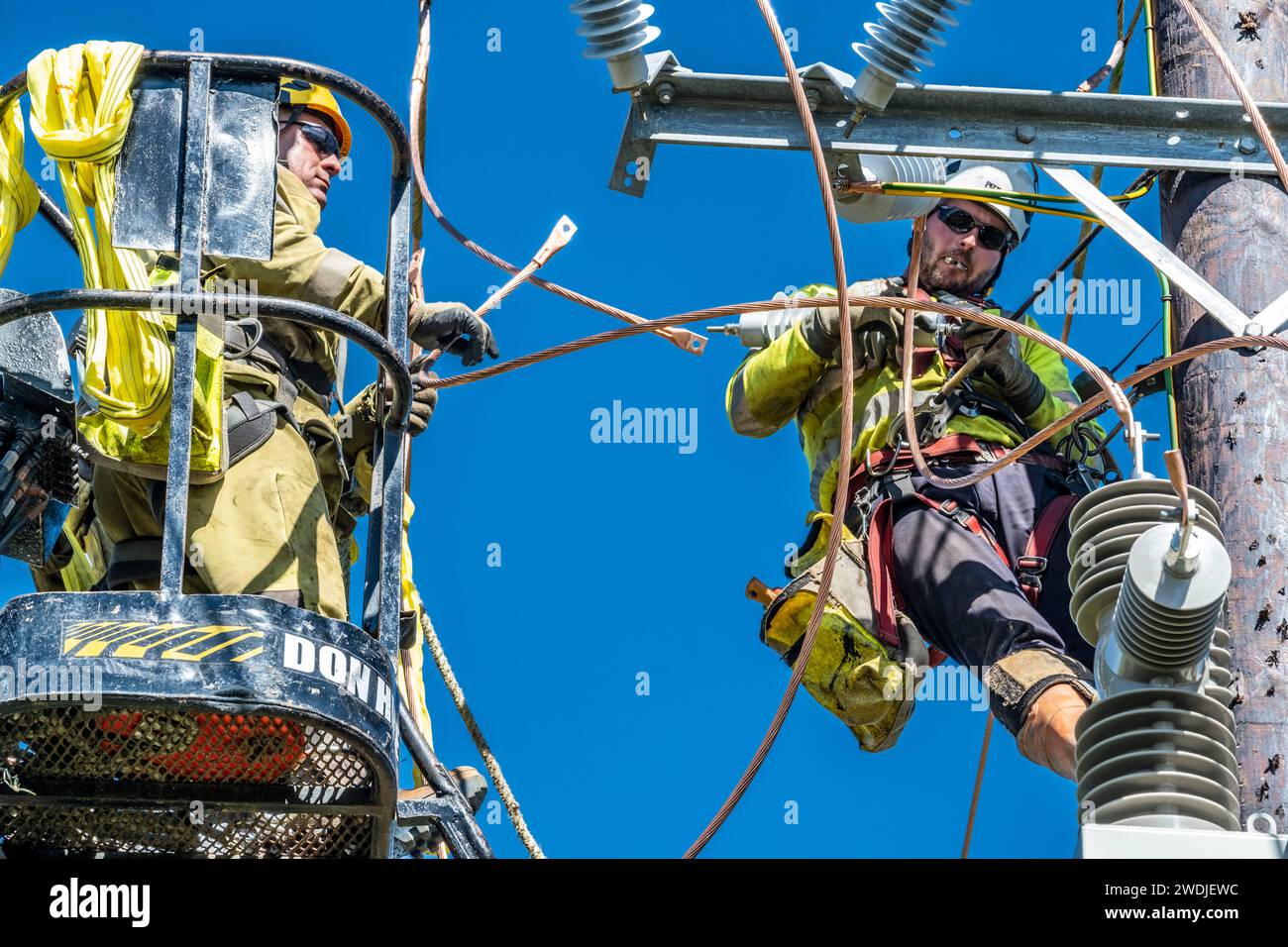 Electricity power line installation Stock Photo - Alamy