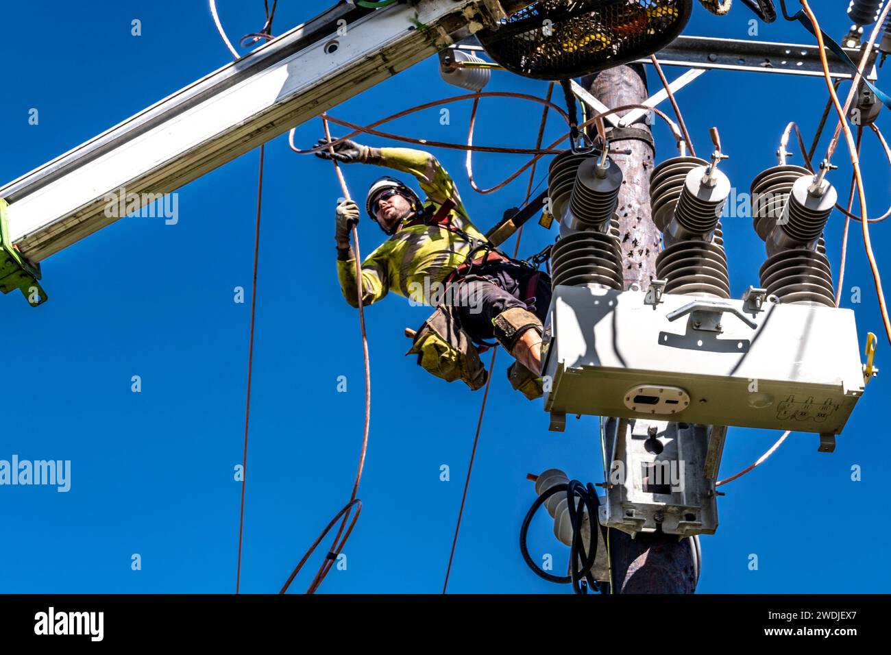 Electricity power line installation Stock Photo - Alamy