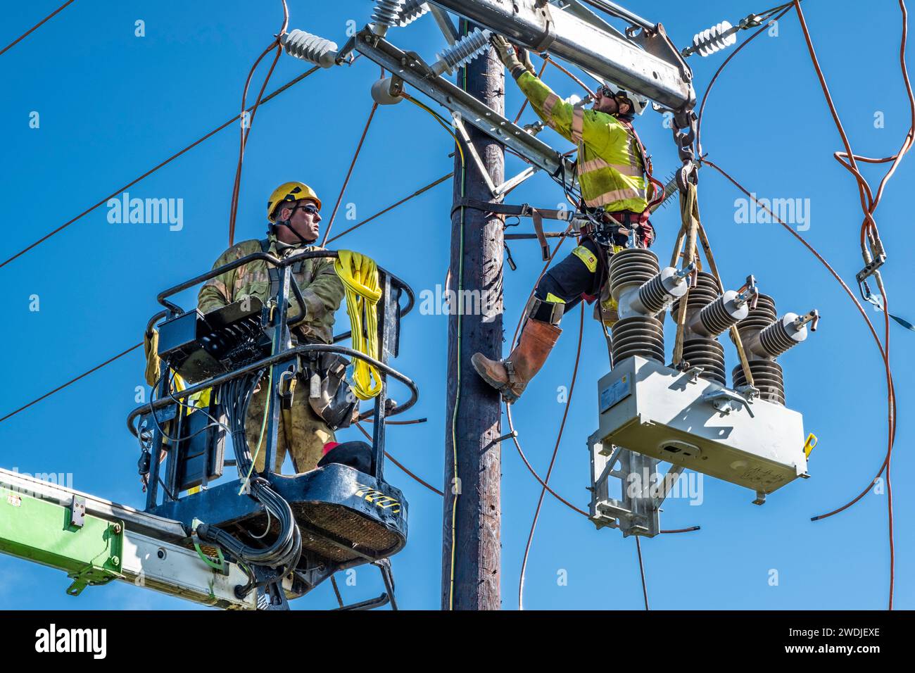 Electricity power line installation Stock Photo - Alamy