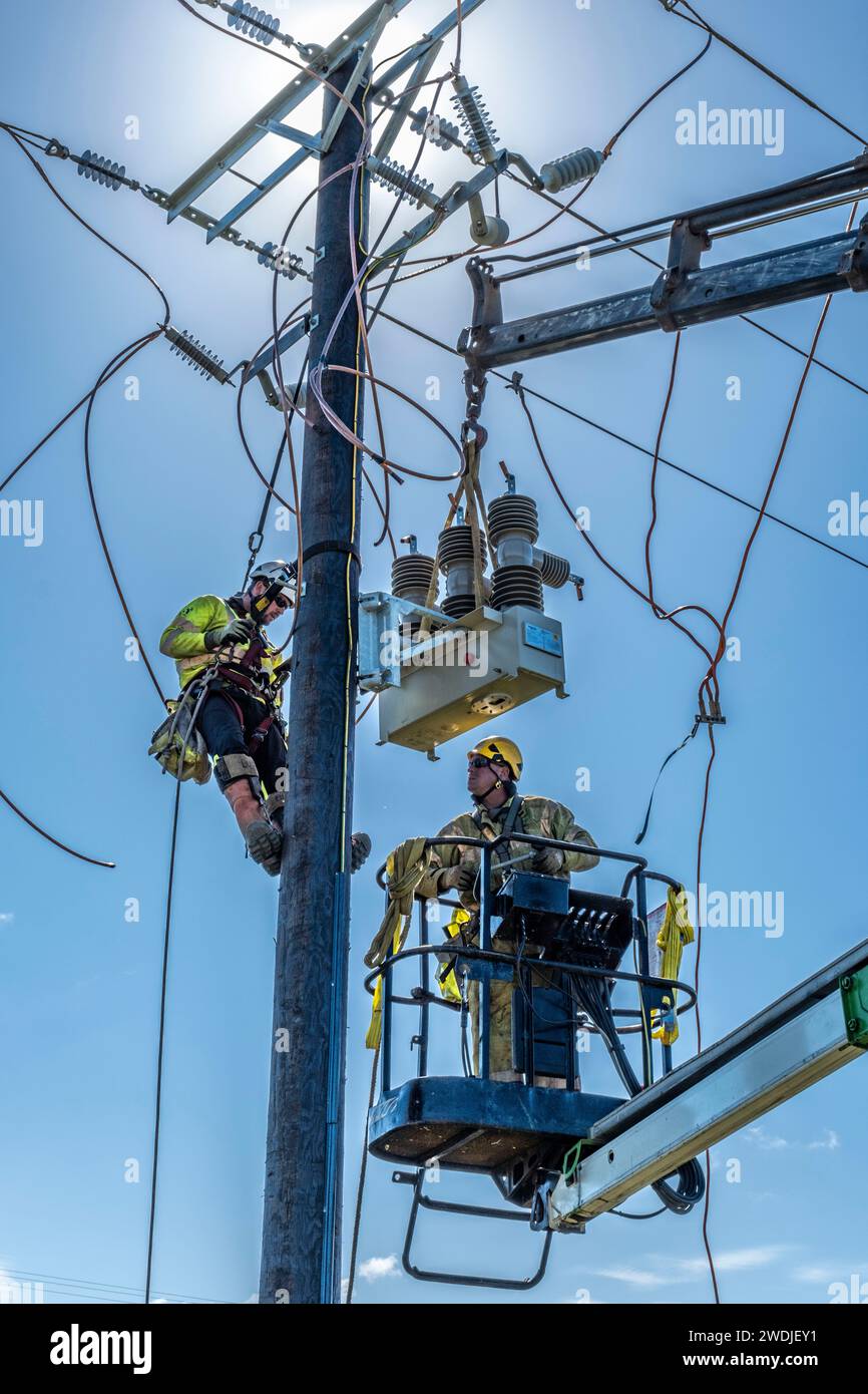 Electricity power line installation Stock Photo - Alamy