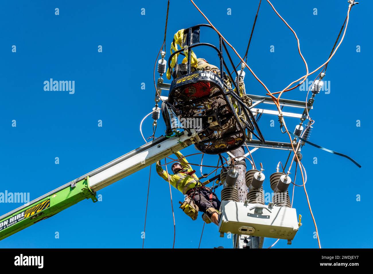 Electricity power line installation Stock Photo - Alamy