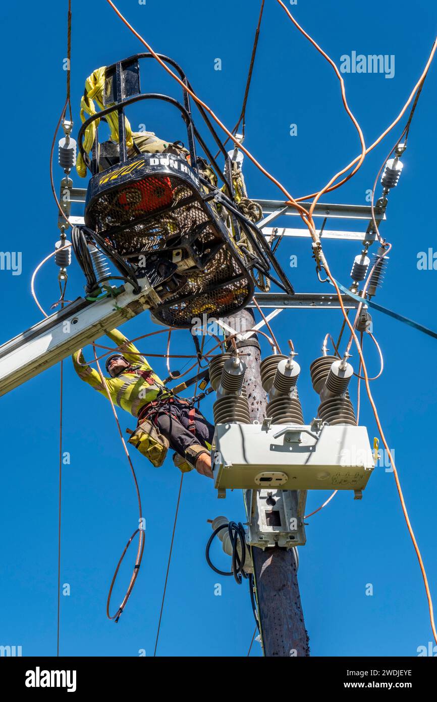 Electricity power line installation Stock Photo - Alamy