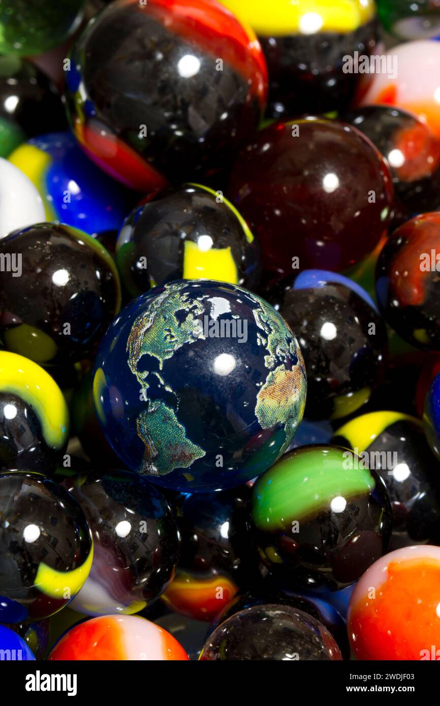 Glass globe earth marbles hi-res stock photography and images - Alamy