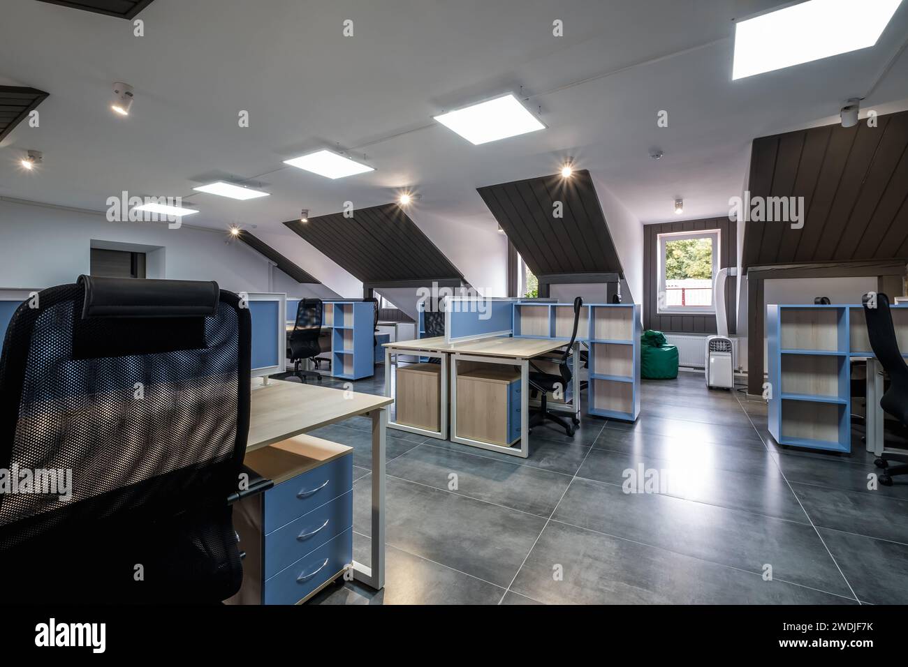 interior in empty work mansard room in modern office or coworking Stock ...