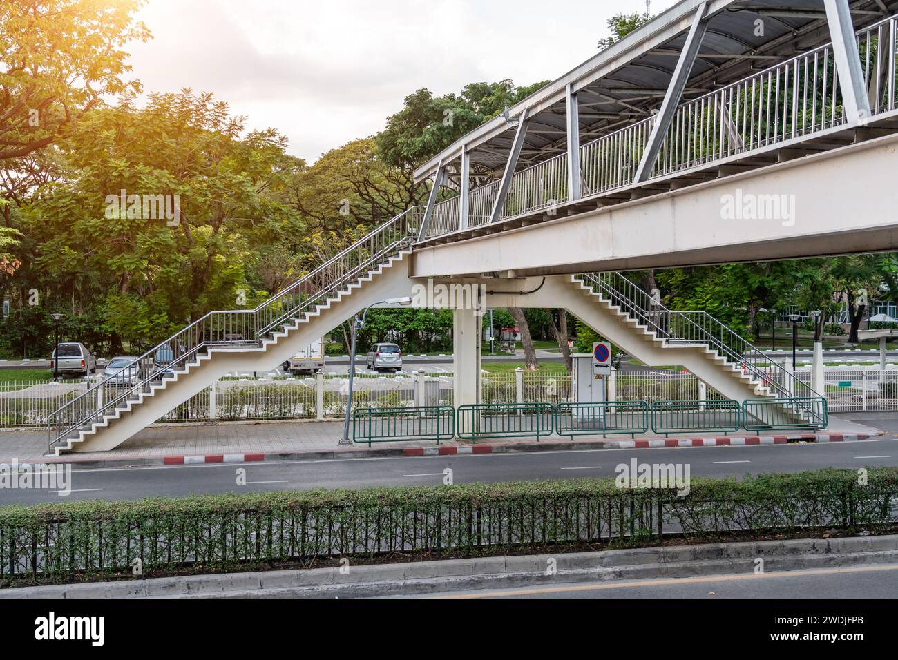 Overhead pedestrian crossing view of the stairs above the highway city ...
