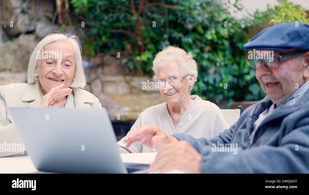 Seniors of geriatric waving during a video call Stock Photo - Alamy