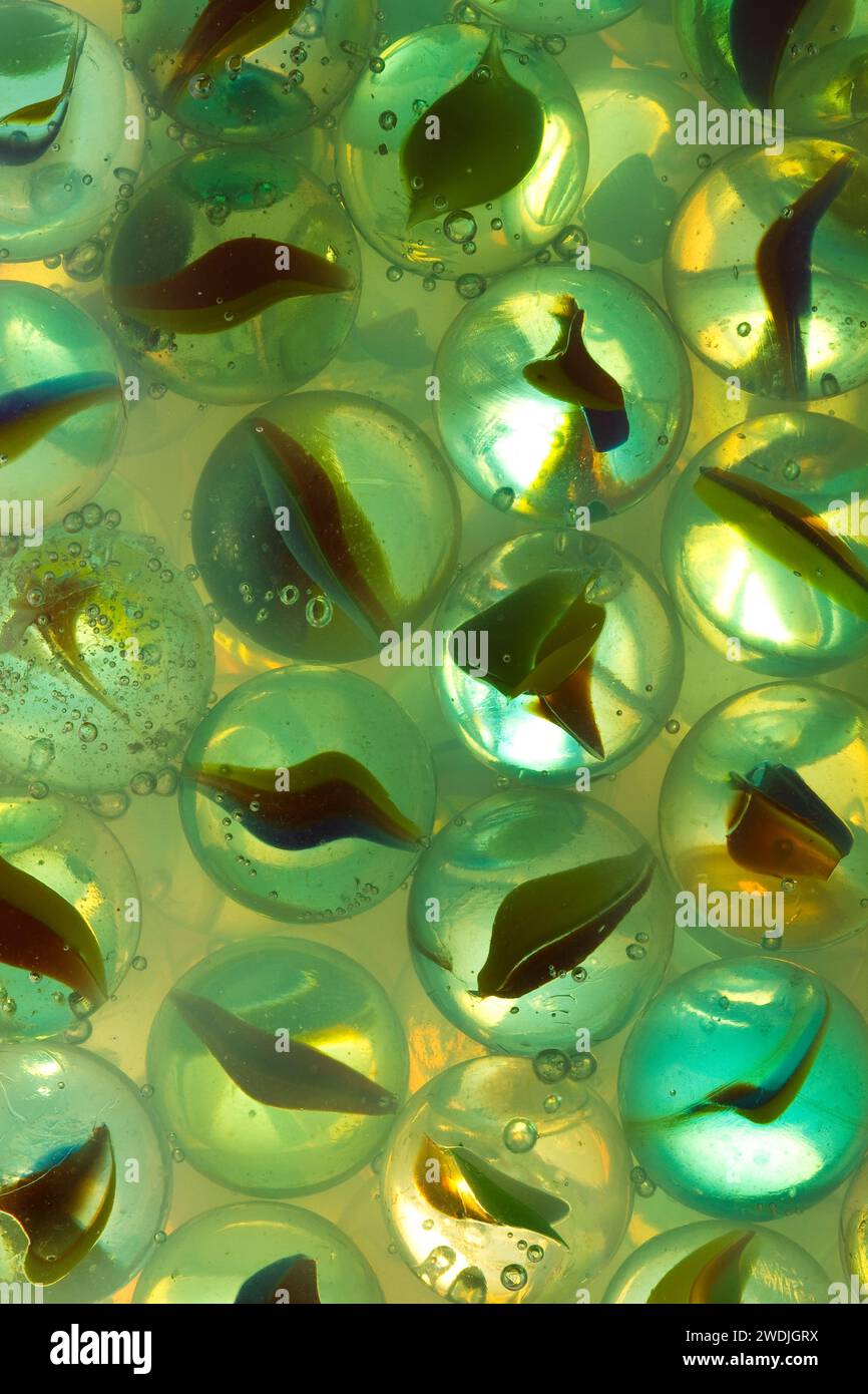 Cat Eye Marbles In Clear Soda Stock Photo - Alamy