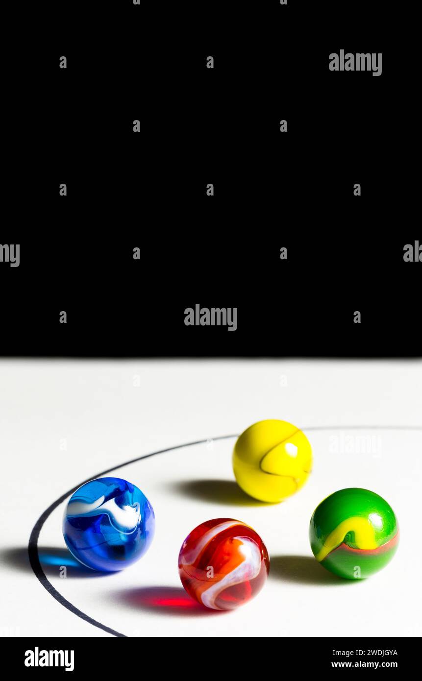 Colorful glass marbles inside a circle Stock Photo - Alamy