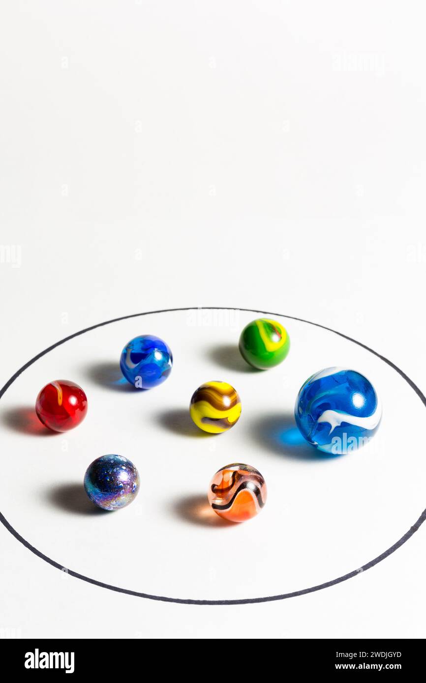 Colorful glass marbles inside a circle Stock Photo - Alamy