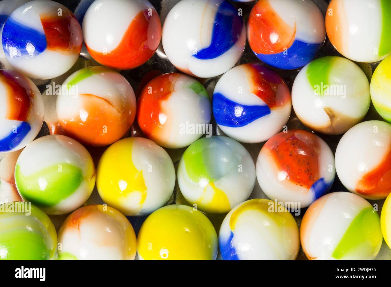 A collection of colorful swirl glass marbles Stock Photo - Alamy
