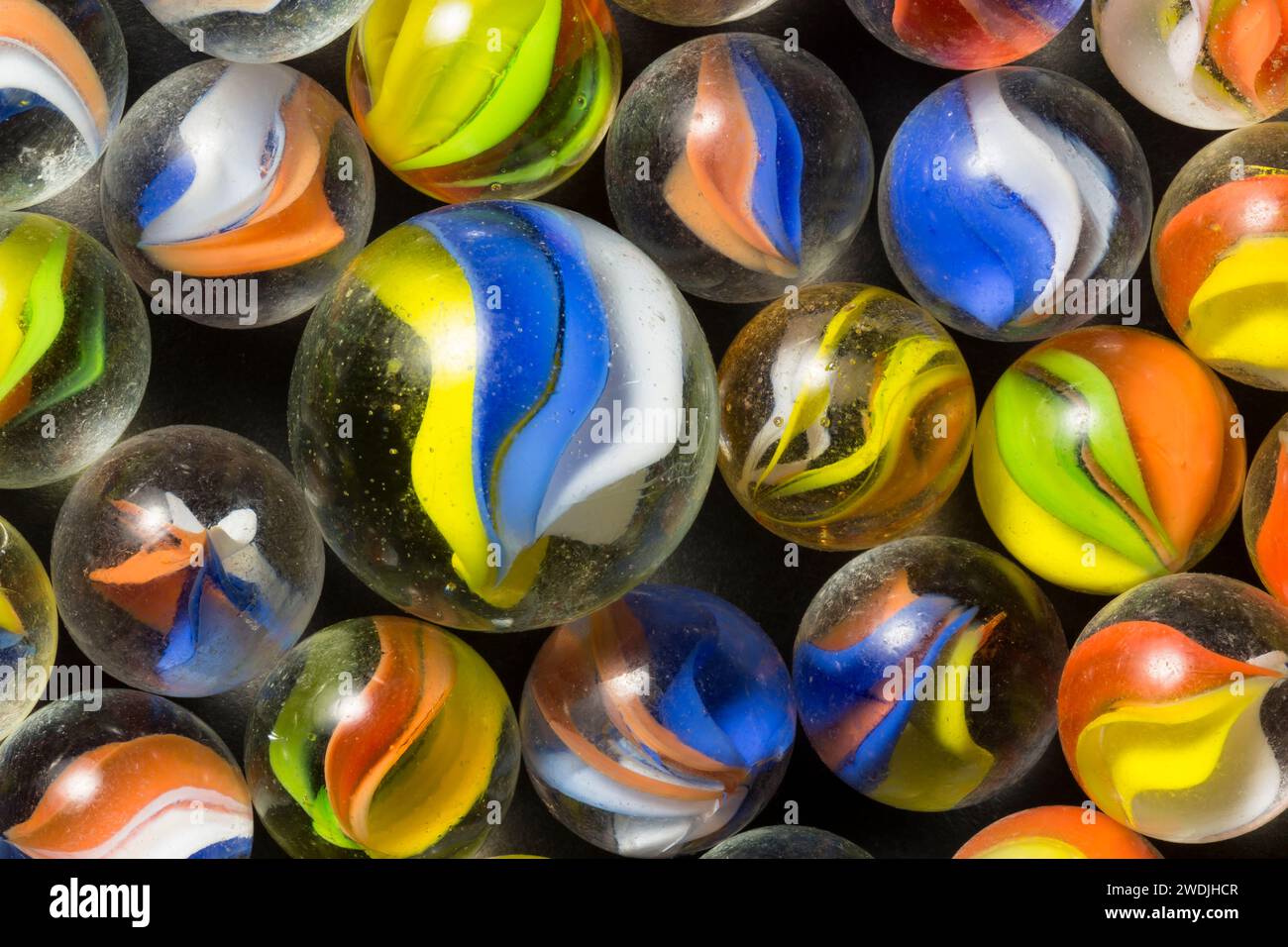 A collection of cat eye glass marbles Stock Photo - Alamy