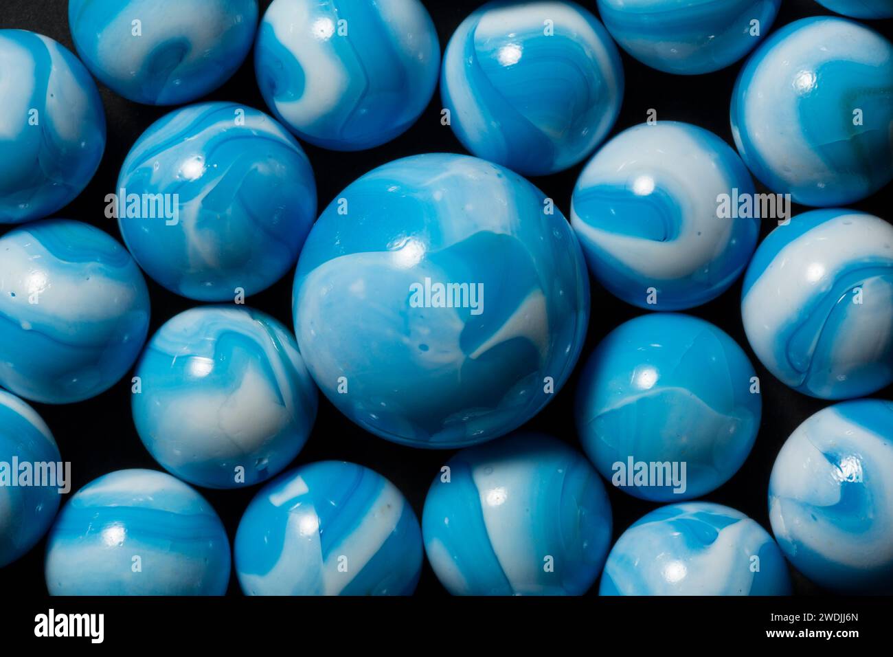 Light Blue and White Swirl Glass Marbles Stock Photo - Alamy