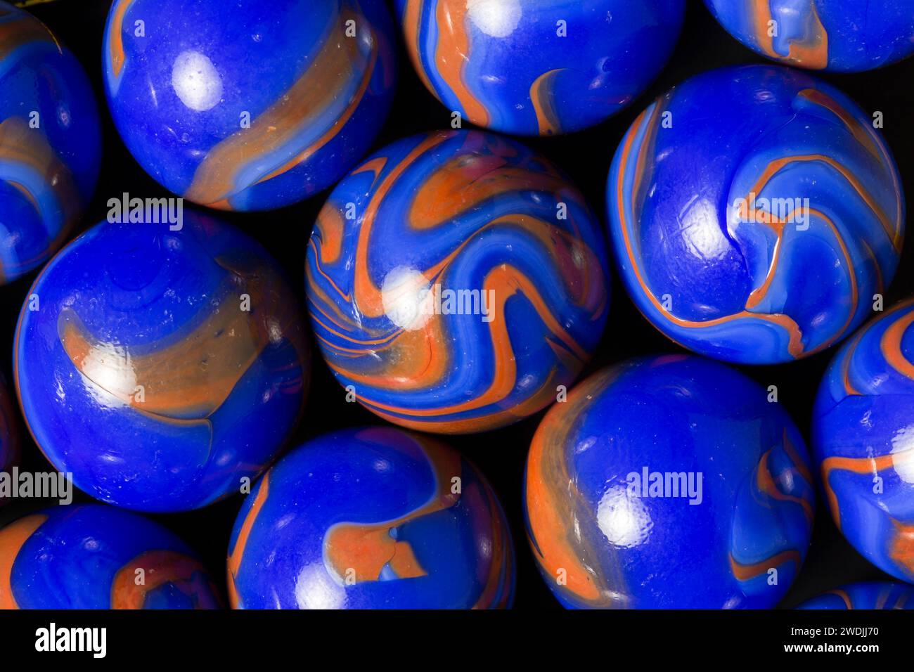 Blue and Orange Swirl Glass Marbles Stock Photo - Alamy