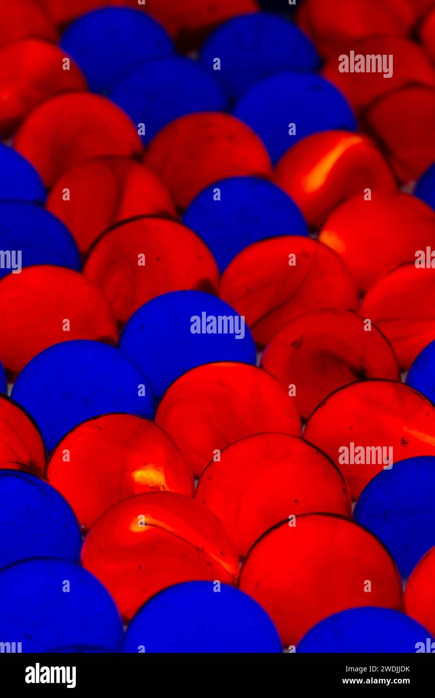 A collection of red and blue translucent glass marbles Stock Photo - Alamy