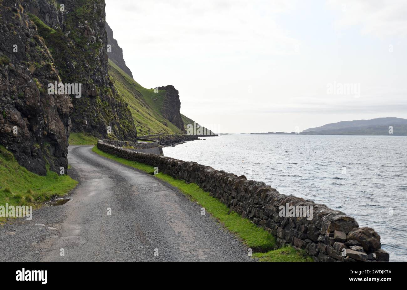 Mountain range and road along Loch na Keal on the isle of Mull ...