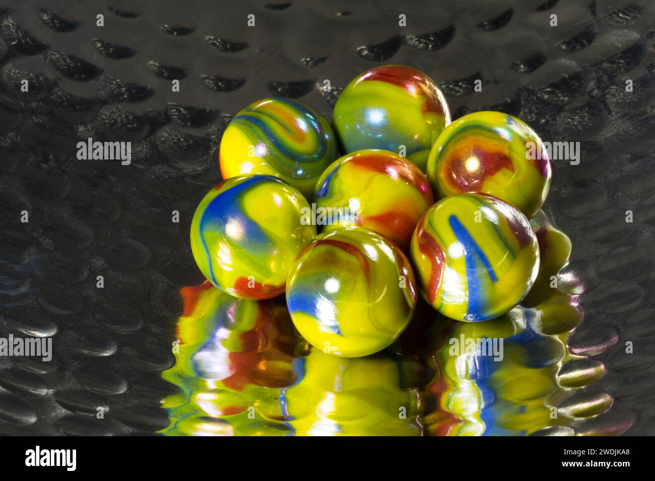 Colorful Glass Marbles In A Metal Bowl Stock Photo - Alamy