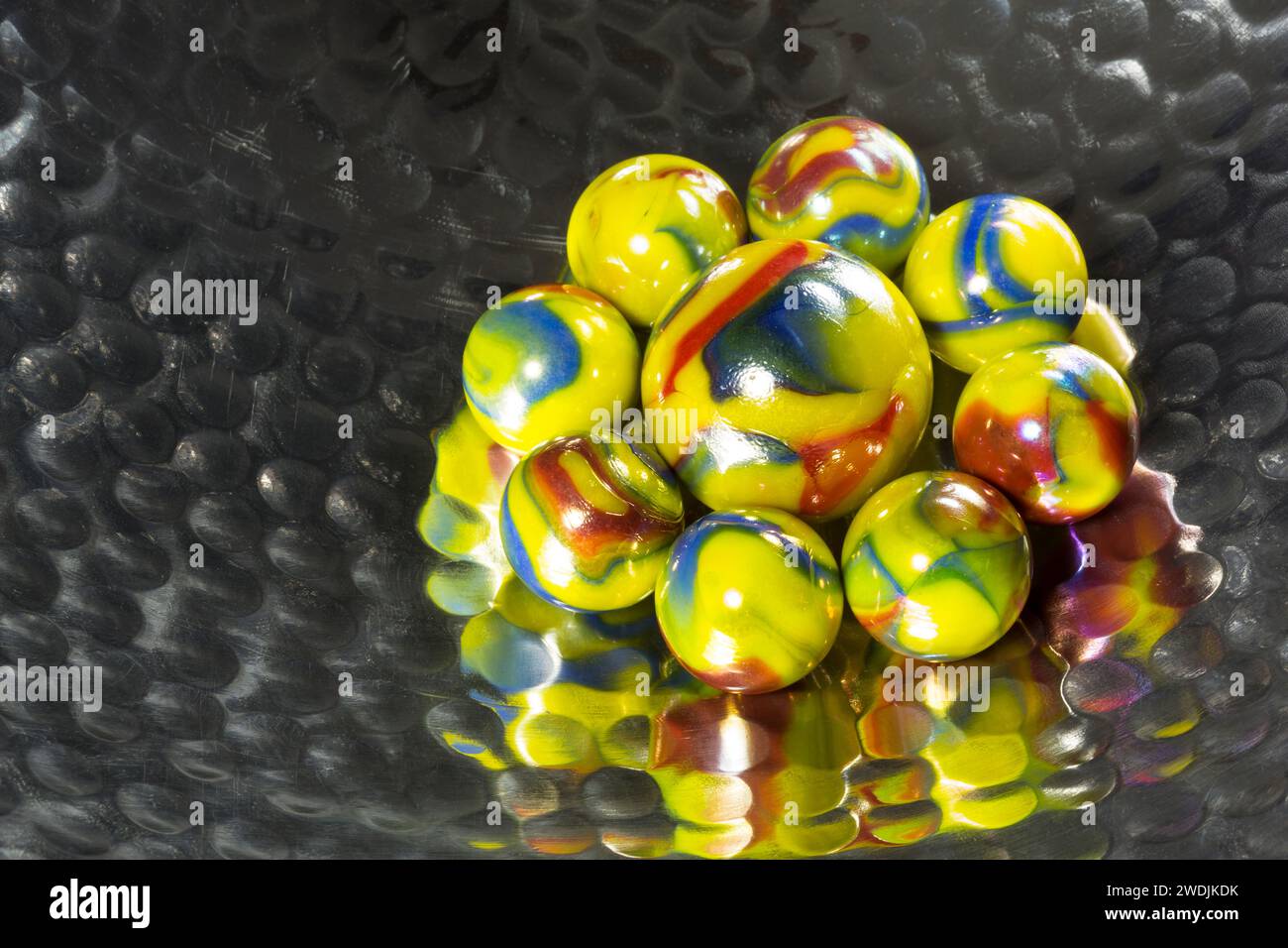 Colorful Glass Marbles In A Metal Bowl Stock Photo - Alamy