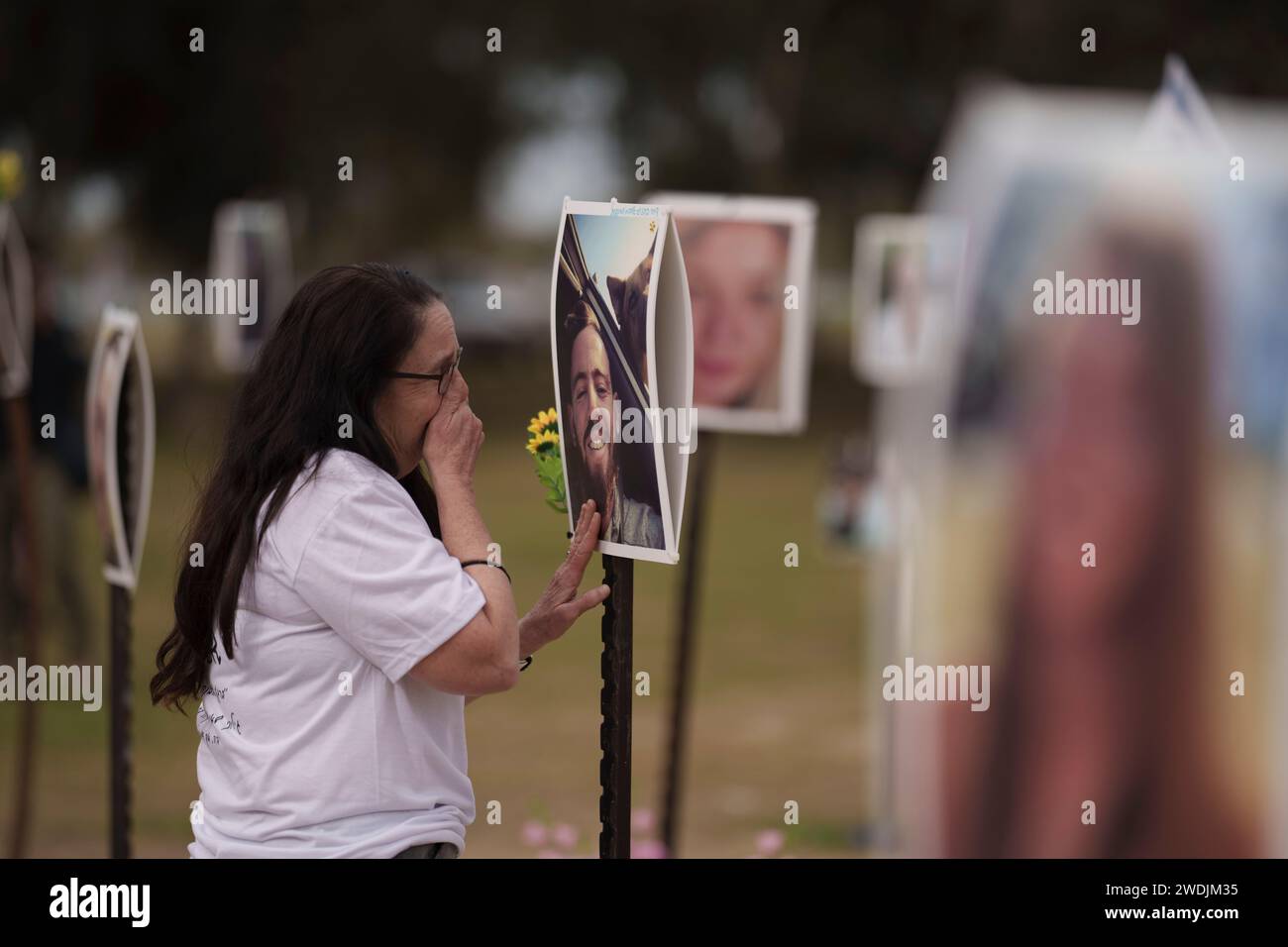 Ela Bahat touches a picture of her 30-year-old son Dror, who was killed ...