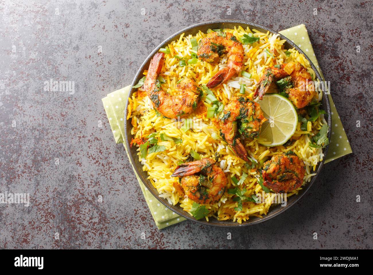 Popular Iranian seafood pilaf Meygoo Polo with herbs and prawns closeup ...