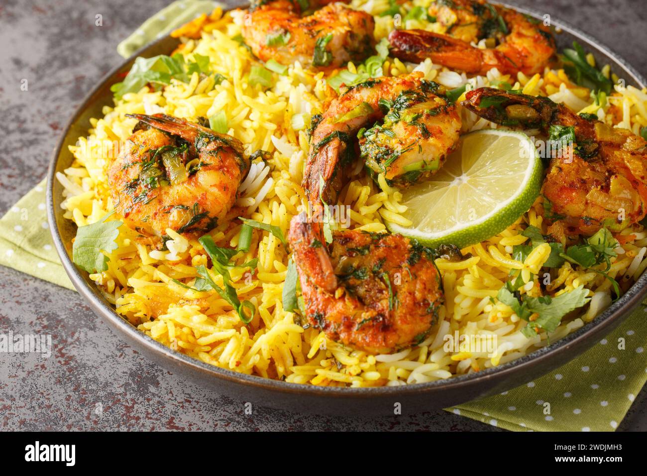 Persian Shrimp Rice Meygoo Polo with herbs and lime closeup on the ...