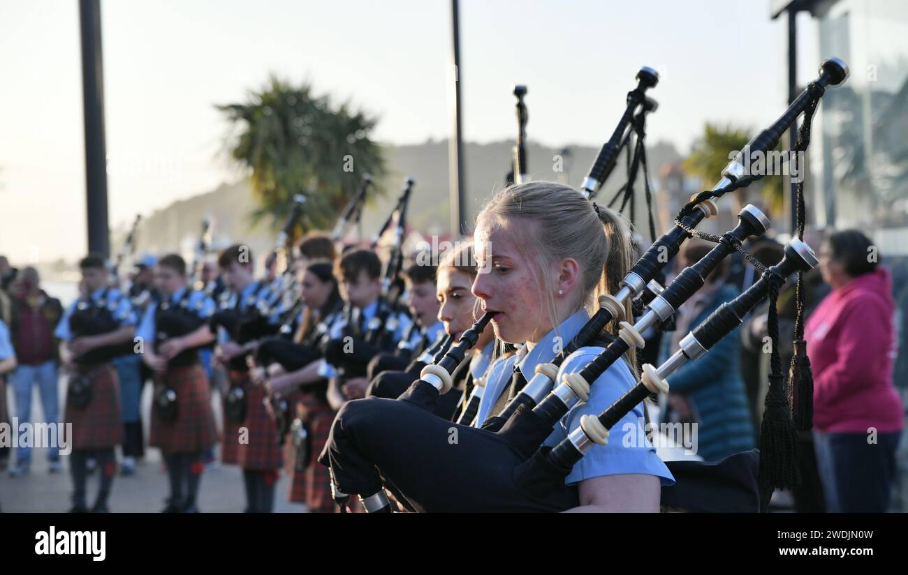 Members of the Oban High School Pipe Band playing in the town centre of ...