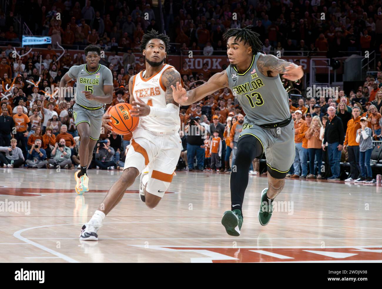 Texas guard Tyrese Hunter (4) drives the ball against Baylor guard ...