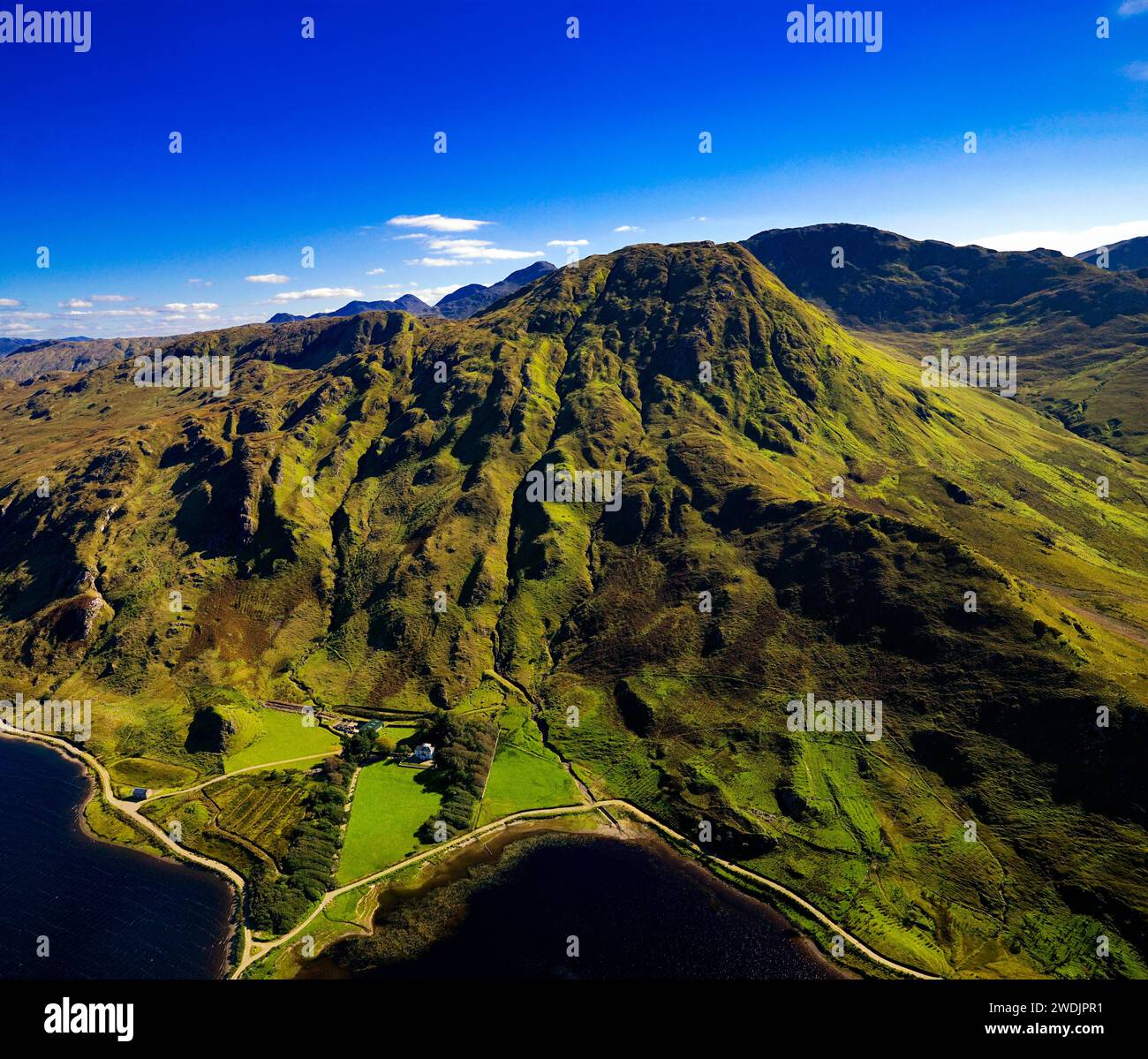 Aerial of Benbaun mountain in the Twelve Bens Connemara, County Galway ...
