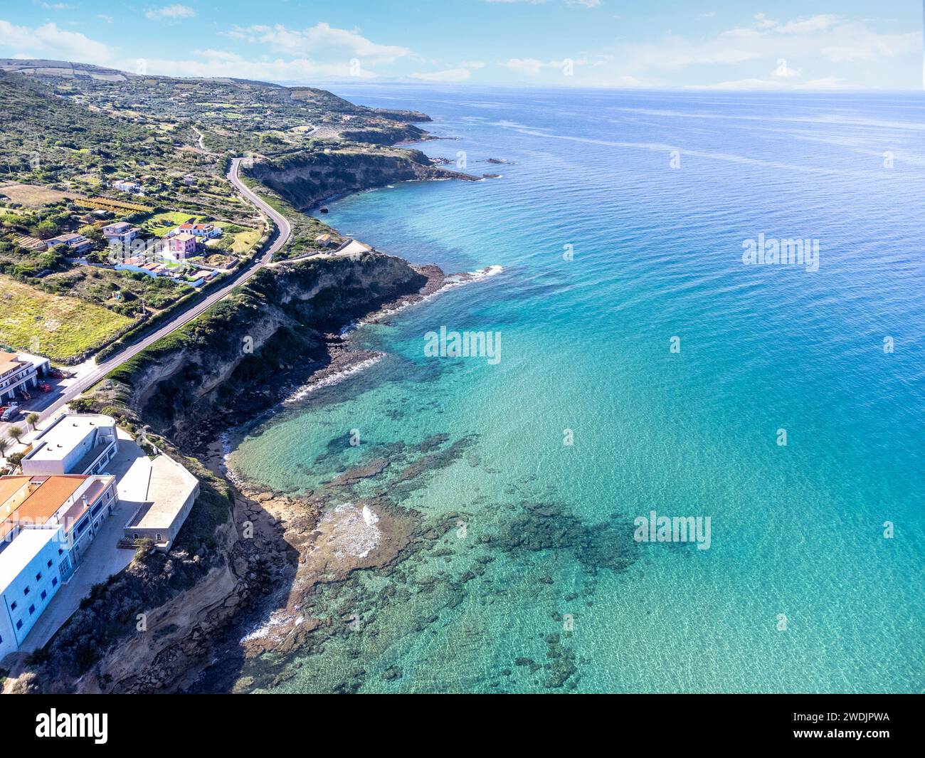 Crystal clear water in Lu Bagnu shoreline seen from above. Sardinia ...