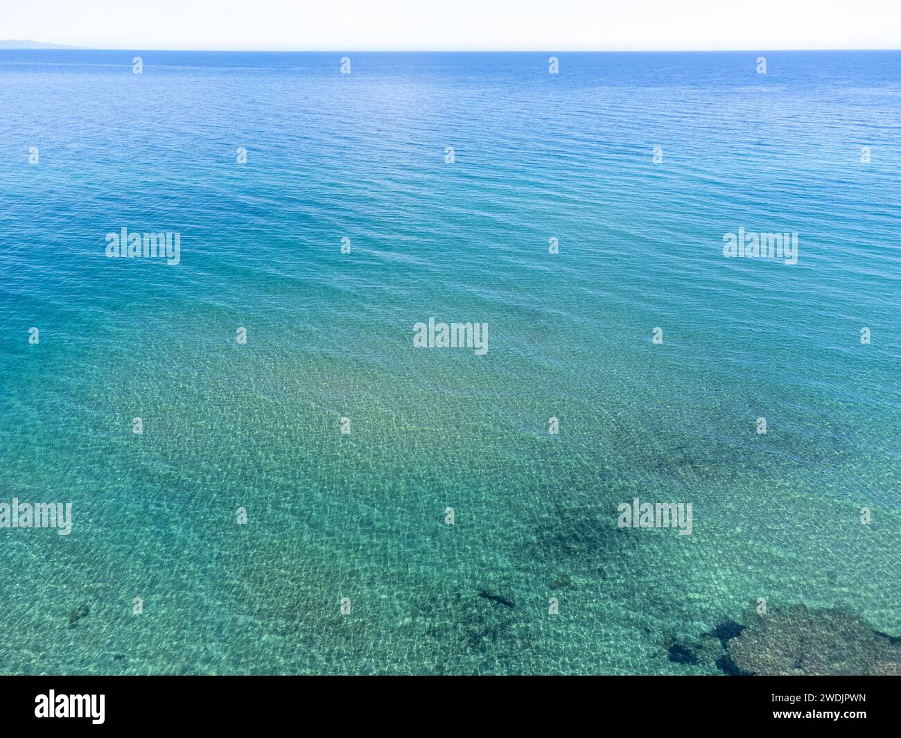 Aerial view of different shades of blue in Castelsardo shore. Sardinia ...