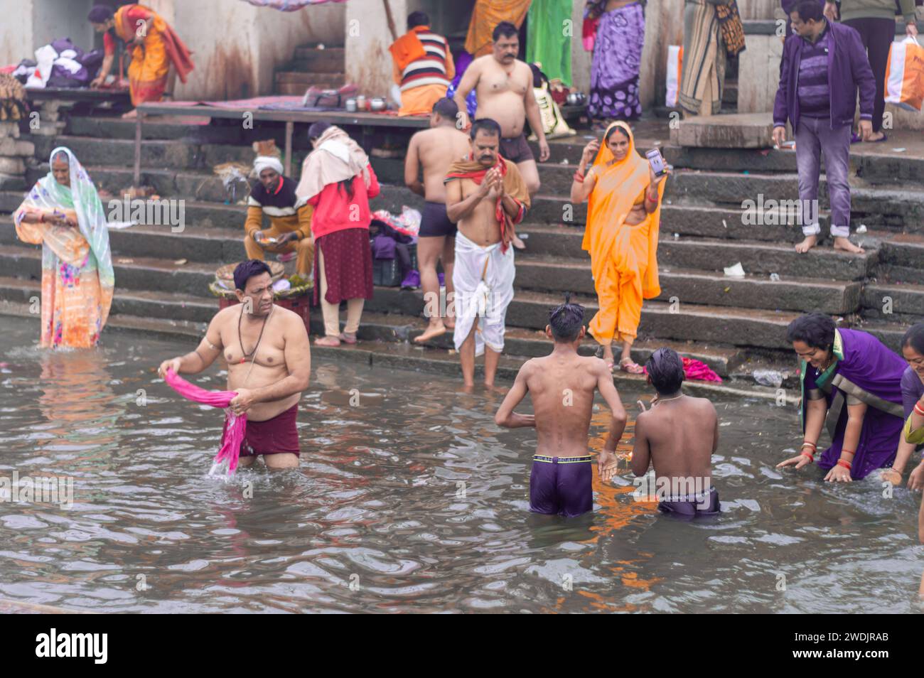 Hindu Sanatan People taking Holi Bath on the Bank of Ganges river in ...