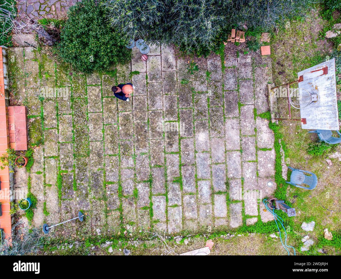 Aerial view of a man playing basketball in the backyard Stock Photo - Alamy