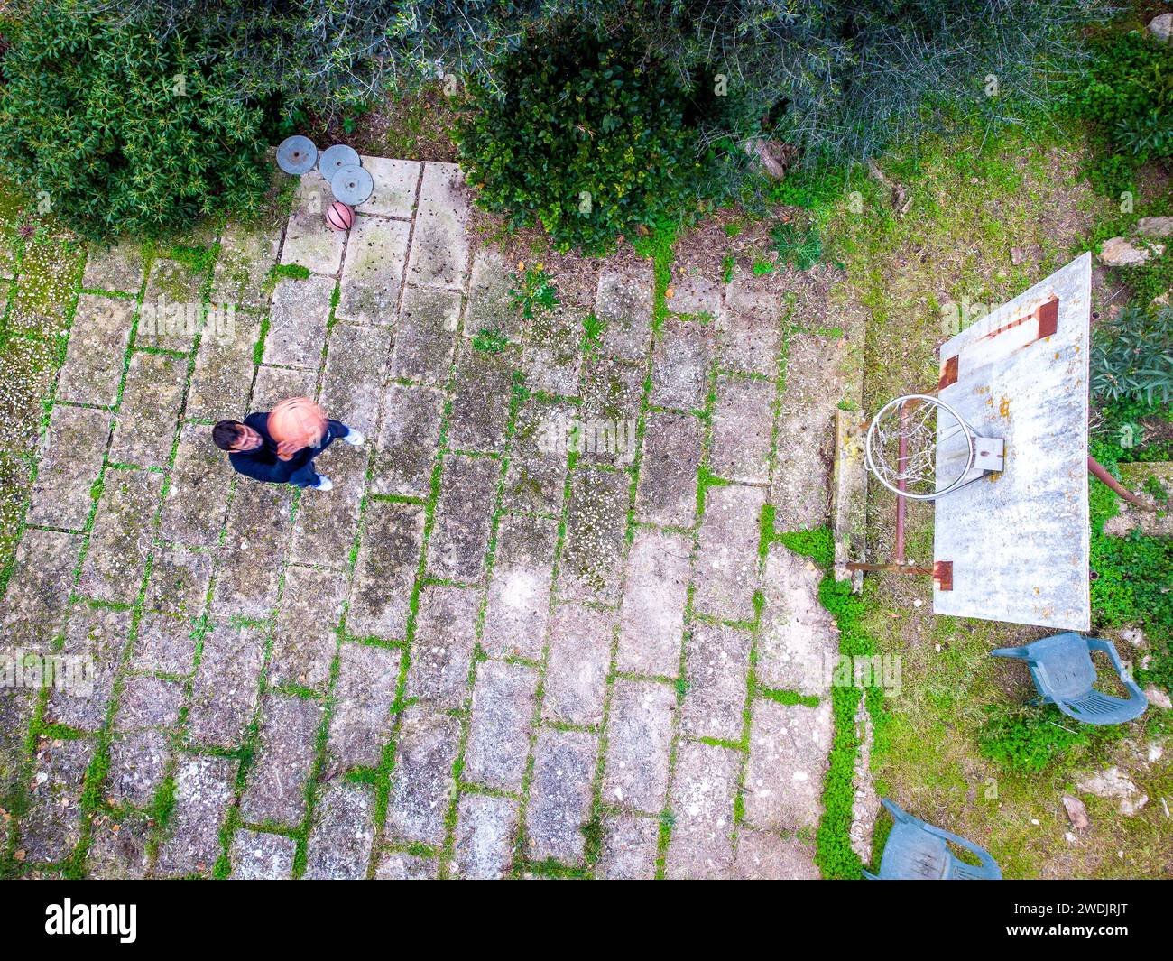 Aerial view of a man practicing jump shot in a backyard Stock Photo - Alamy