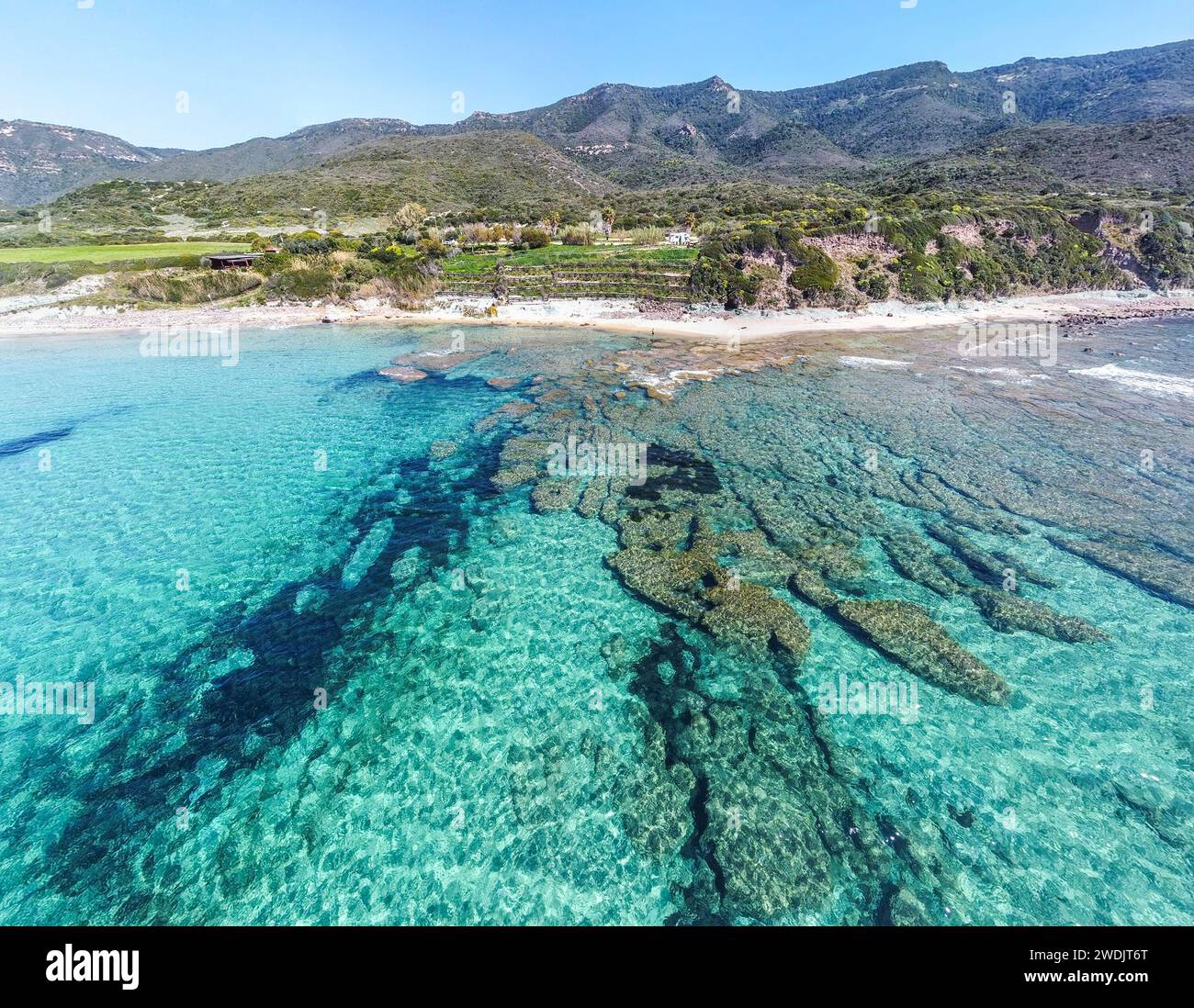 Aerial view of La Speranza beach under a blue sky. Sardinia, Italy ...
