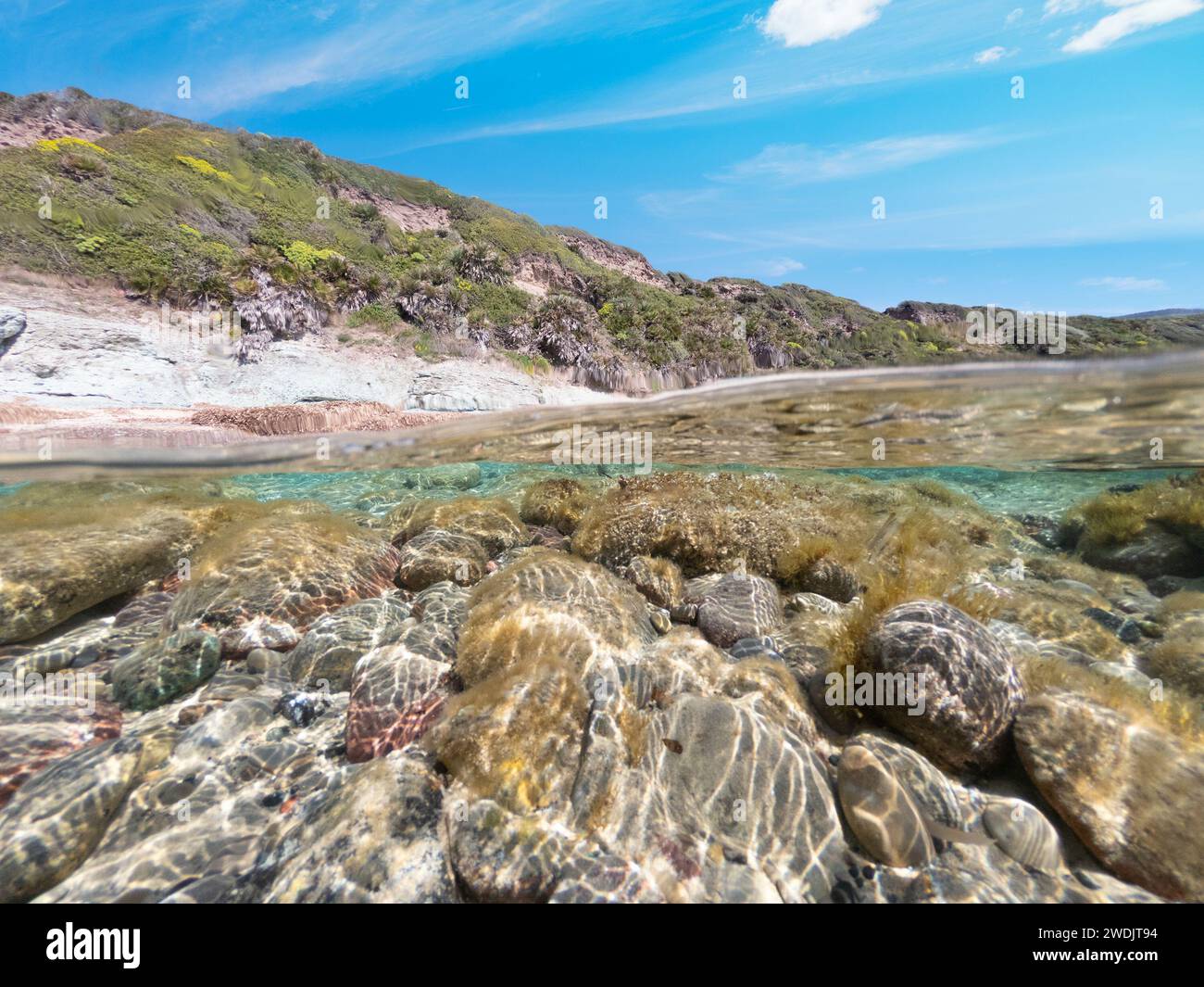 Split underwater view of rocks in La Speranza seabed. Sardinia, Italy ...