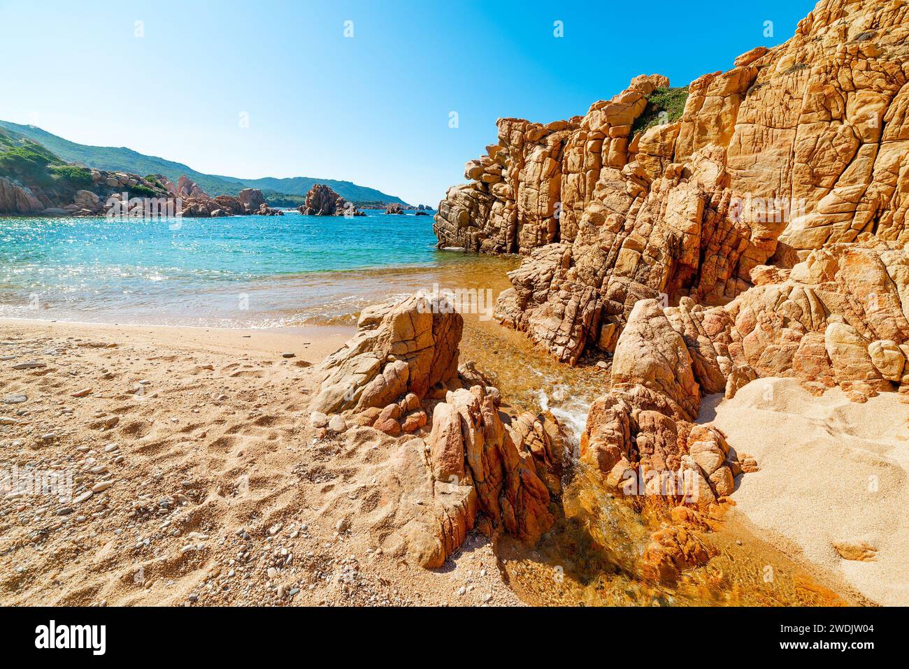 Sand and rocks in Li Cossi beach. Sardinia, Italy Stock Photo - Alamy