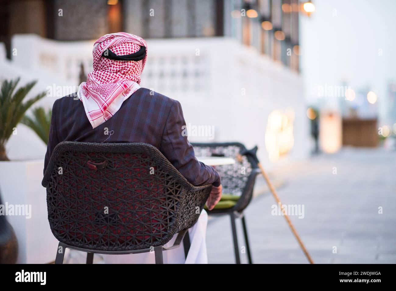 Doha, Qatar - April 22,2023: Local people in traditional attire in old ...