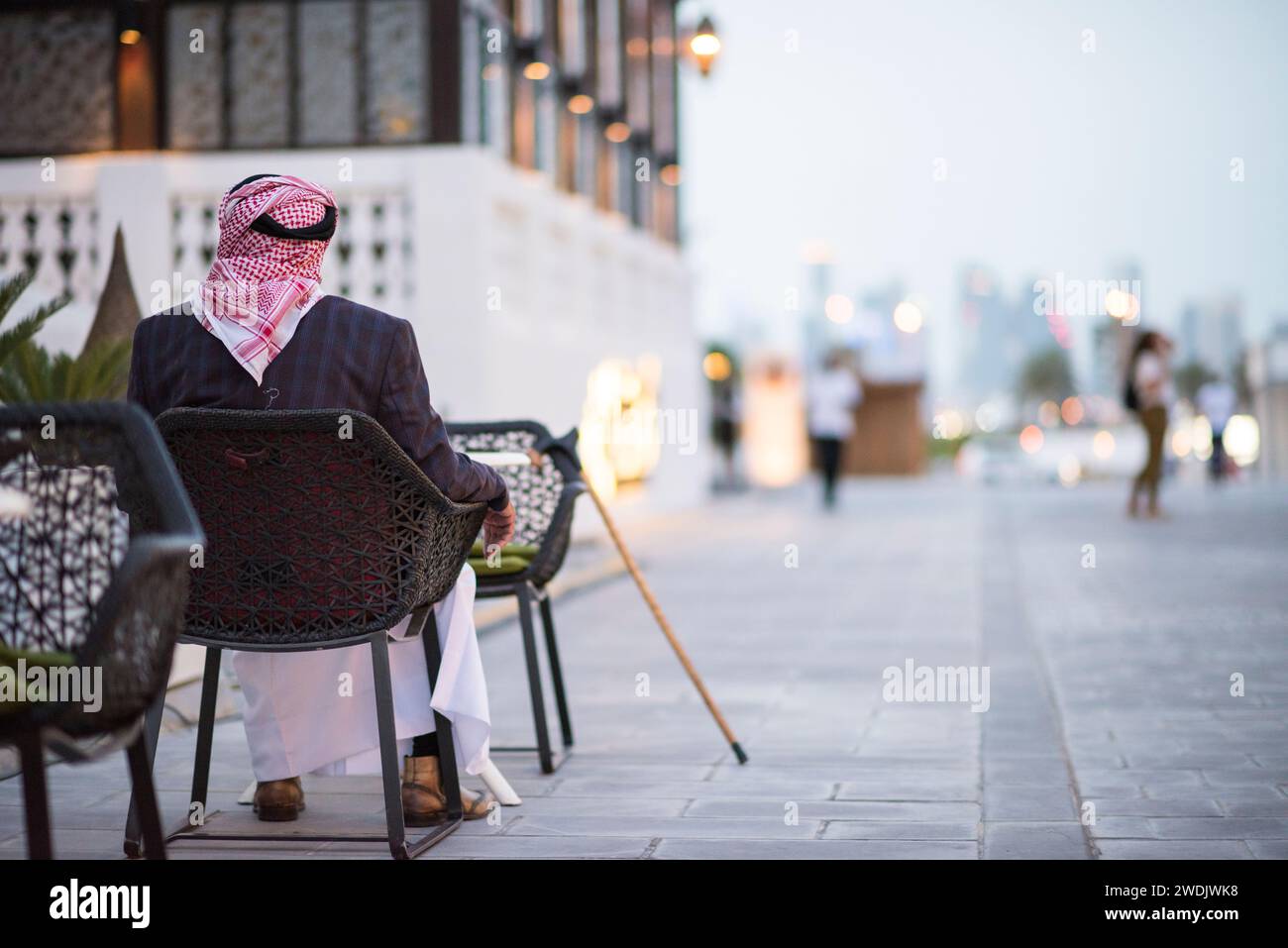 Doha, Qatar - April 22,2023: Local people in traditional attire in old ...
