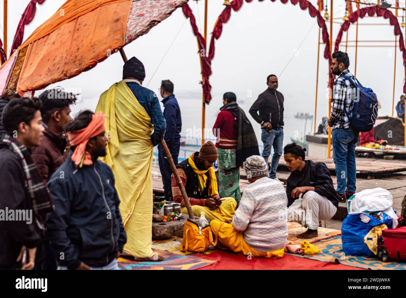 Hindu devotees performing religious rituals during kumbha mela in ...
