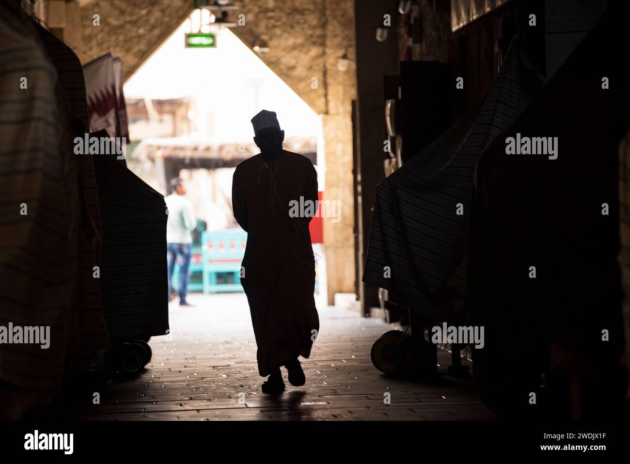 Doha, Qatar - April 22,2023: Local people in traditional attire in old ...