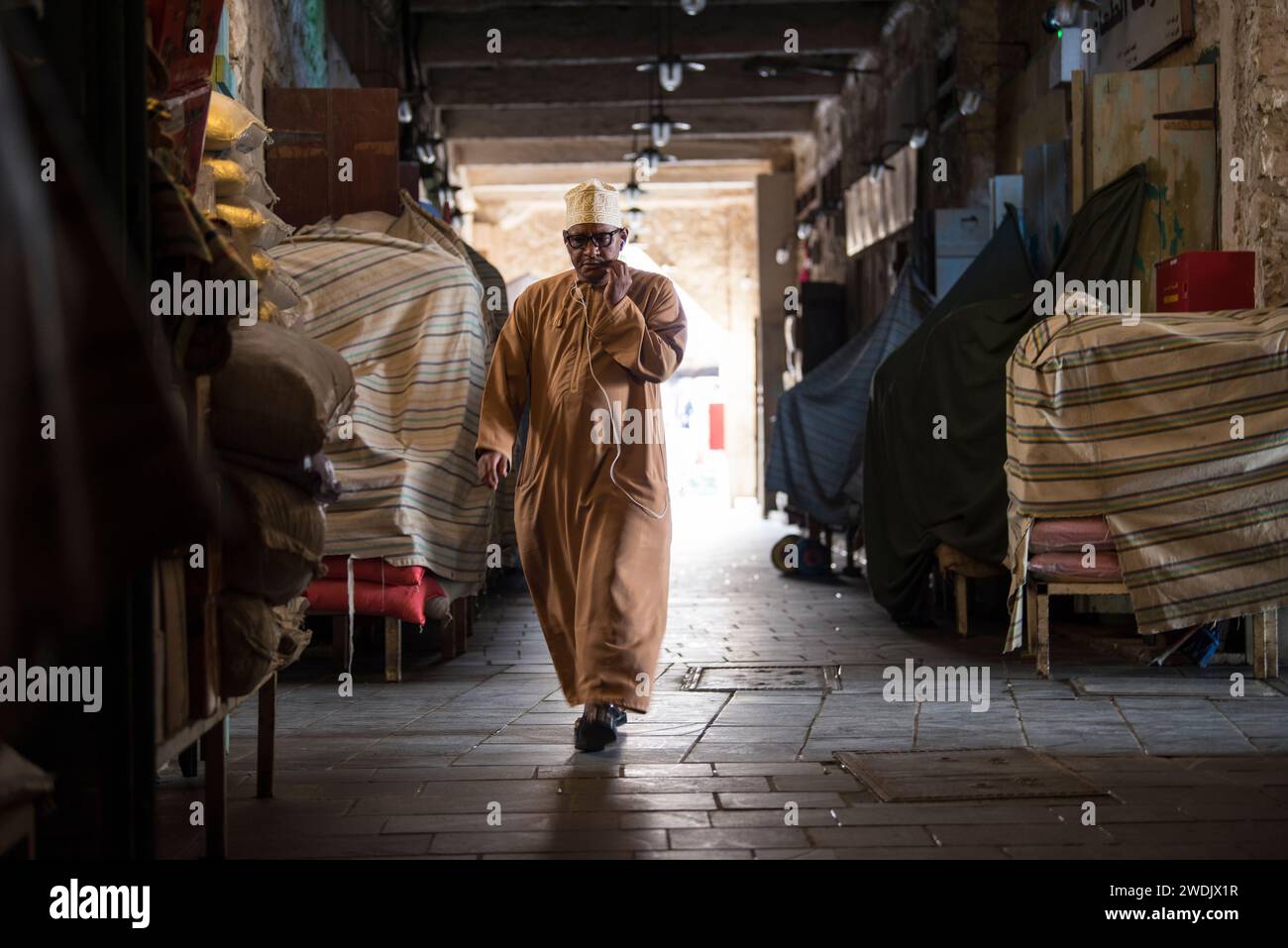 Doha, Qatar - April 22,2023: Local people in traditional attire in old ...