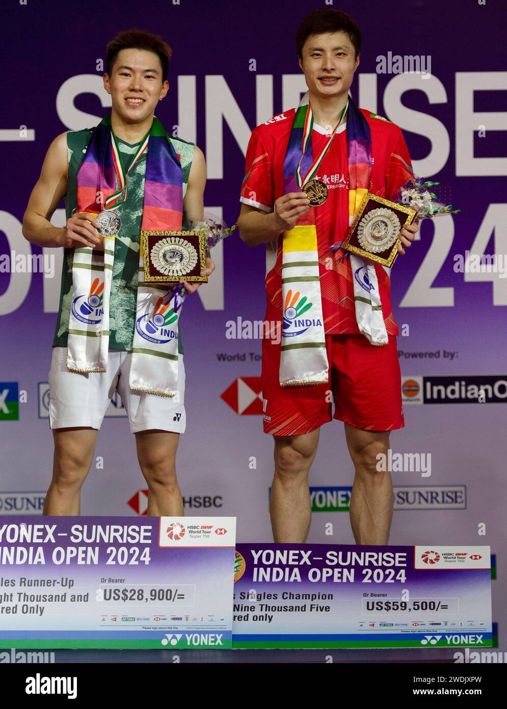 New Delhi, India. 21st Jan, 2024. Champion Shi Yuqi (R) of China and ...