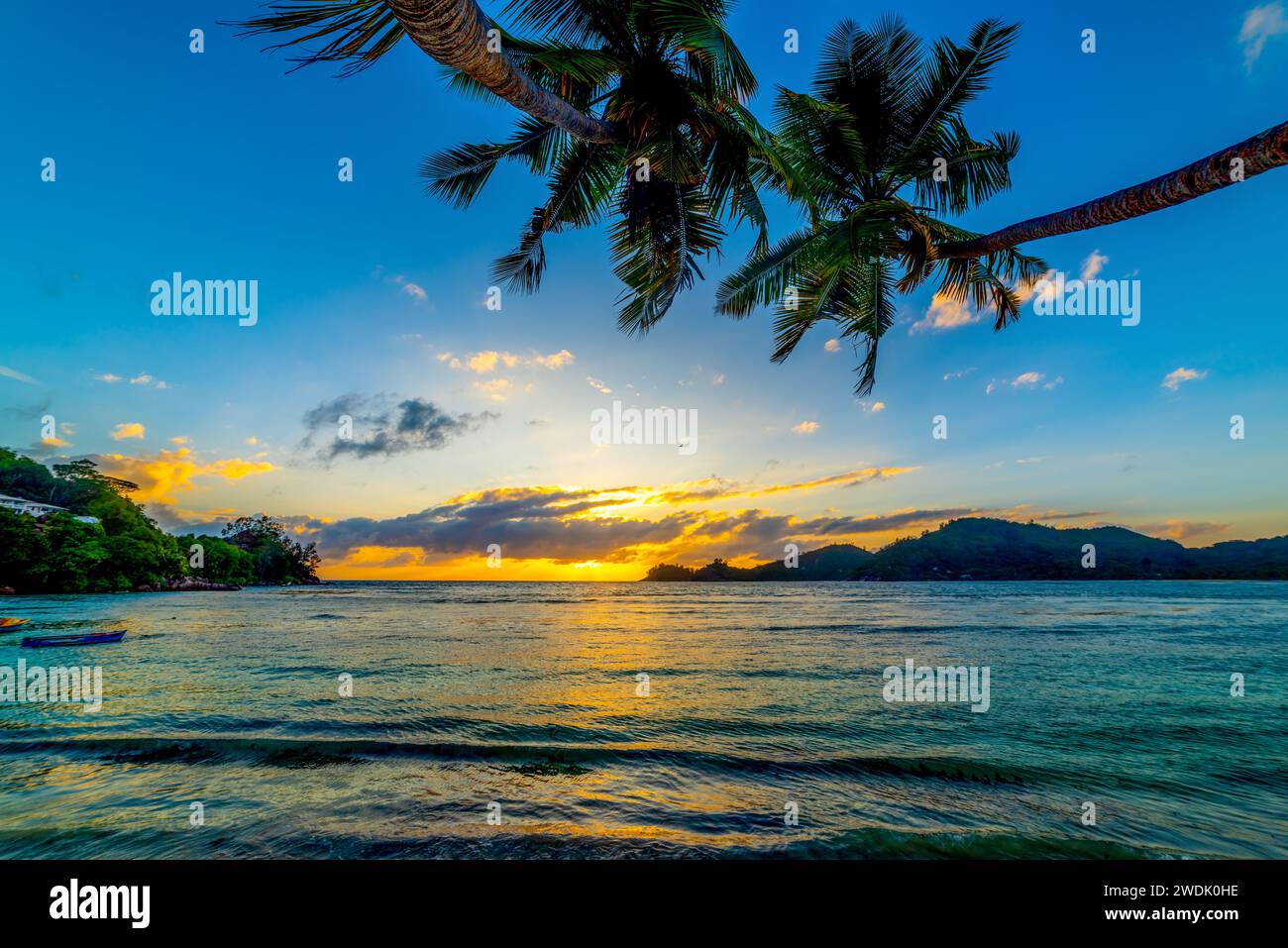 Scenic sunset in Baie Lazare beach. Mahe island, Seychelles Stock Photo ...